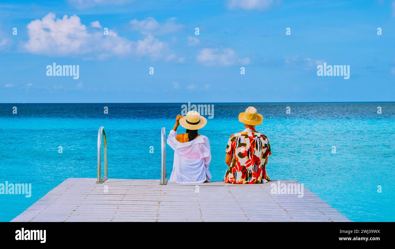 Couple visit Playa Porto Marie beach Curacao, white tropical beach with ...