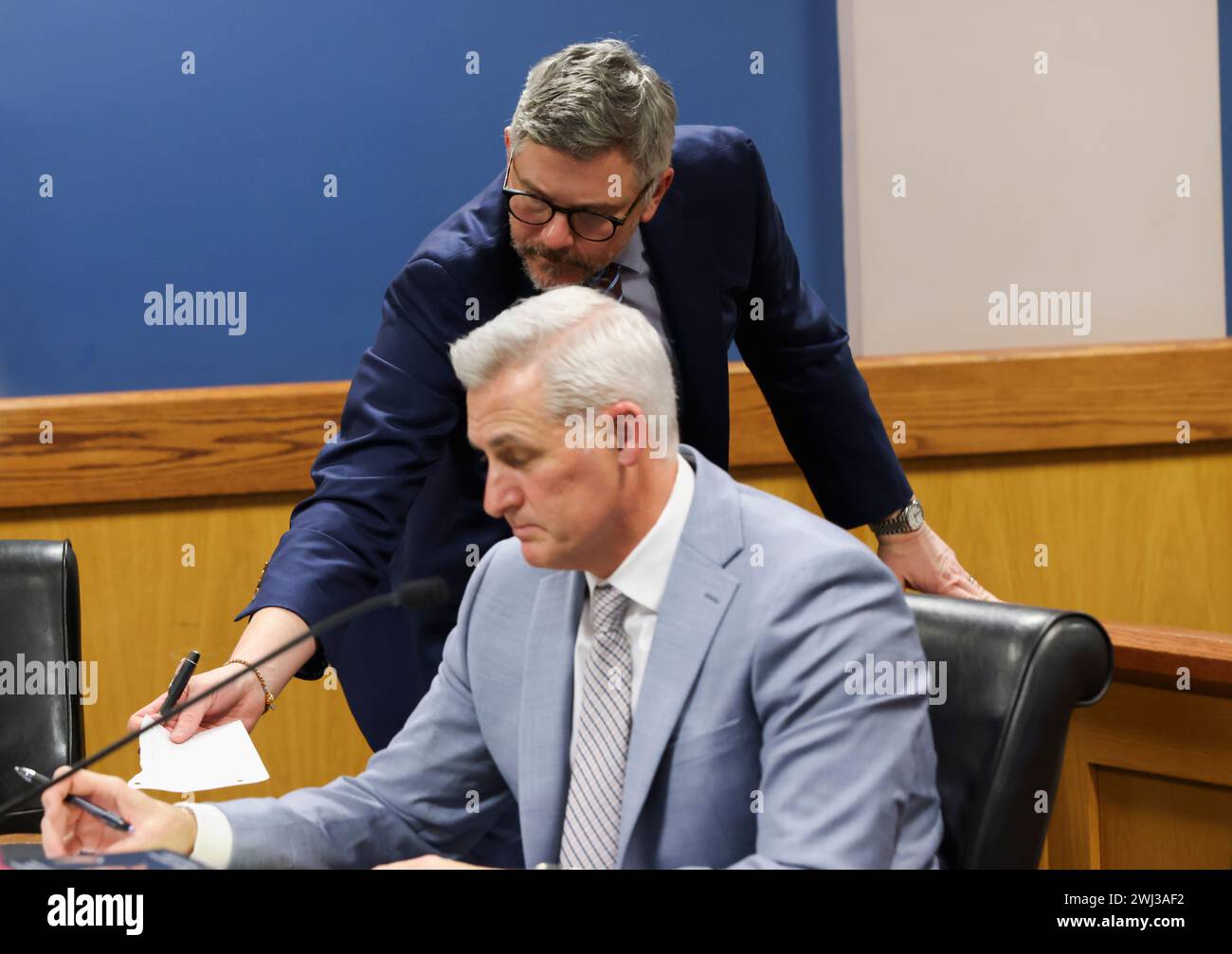 Chris Anulewicz, attorney for Robert Cheeley, passes a note to John ...