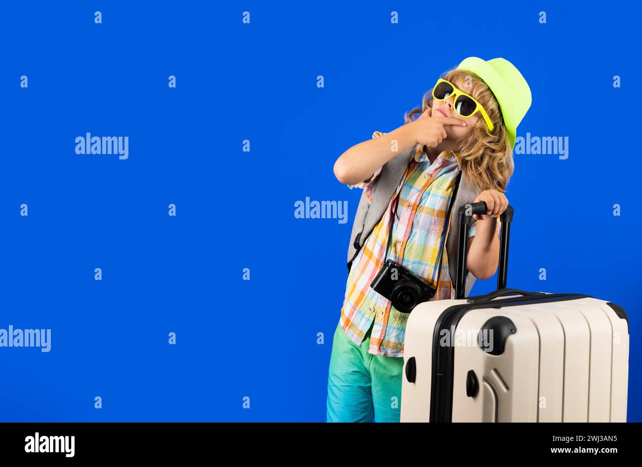 Traveler tourist kid boy 7-8 years old on isolated studio background ...