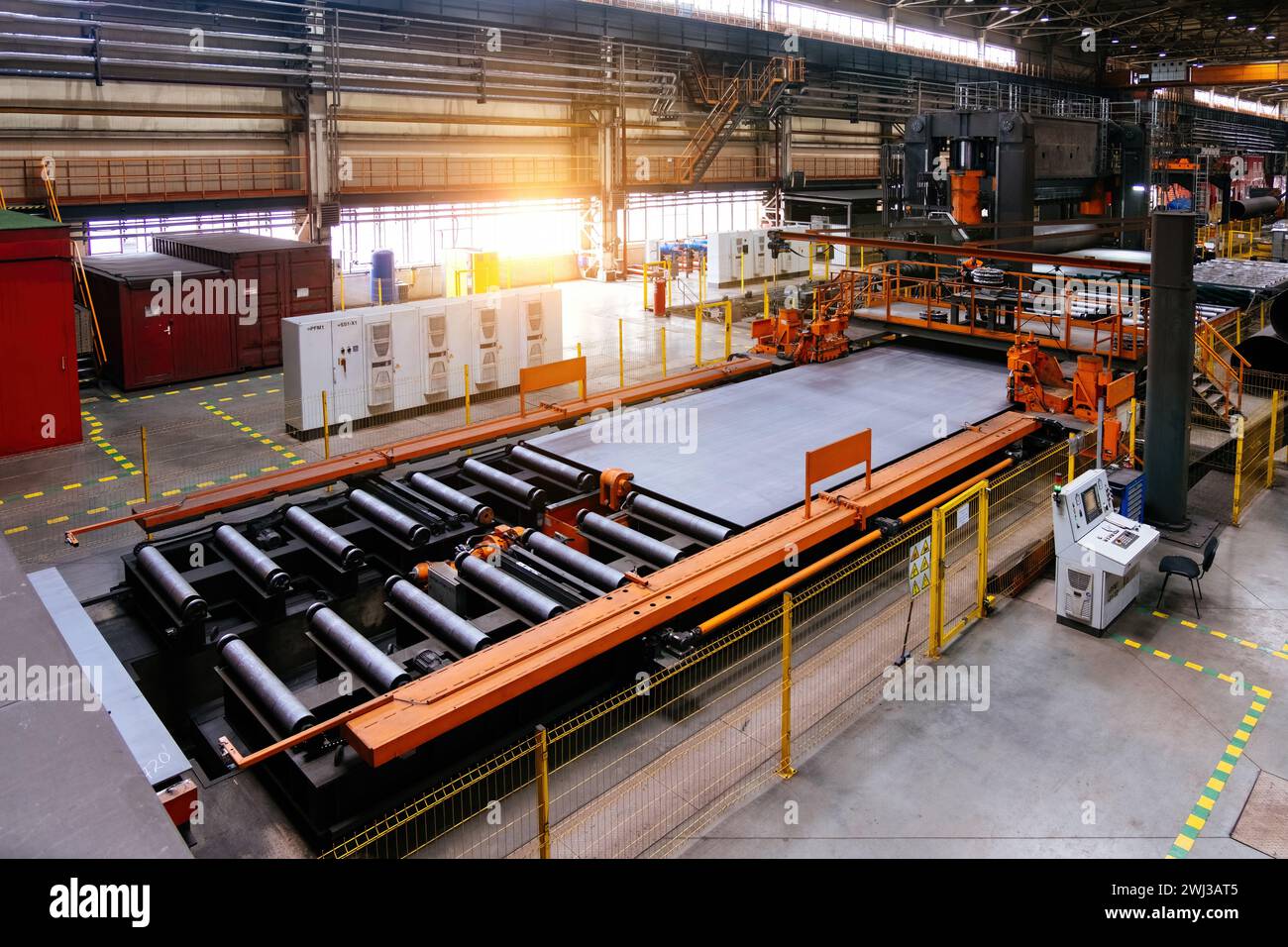 Pipe factory production line. Tube formation by roll sheet bending ...