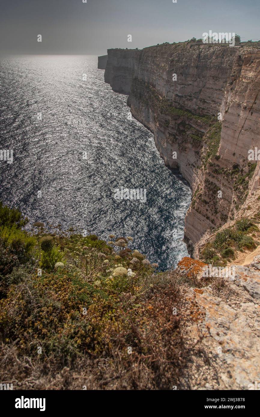 The sunset over the ocean with beautiful sunlight in Ta Cenc cliffs in ...