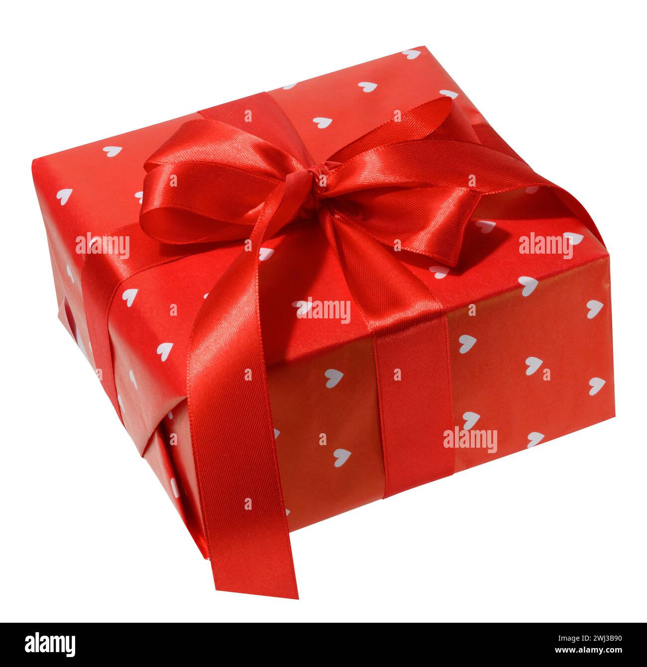 Box is wrapped in red gift wrapping and red ribbon on a white isolated ...