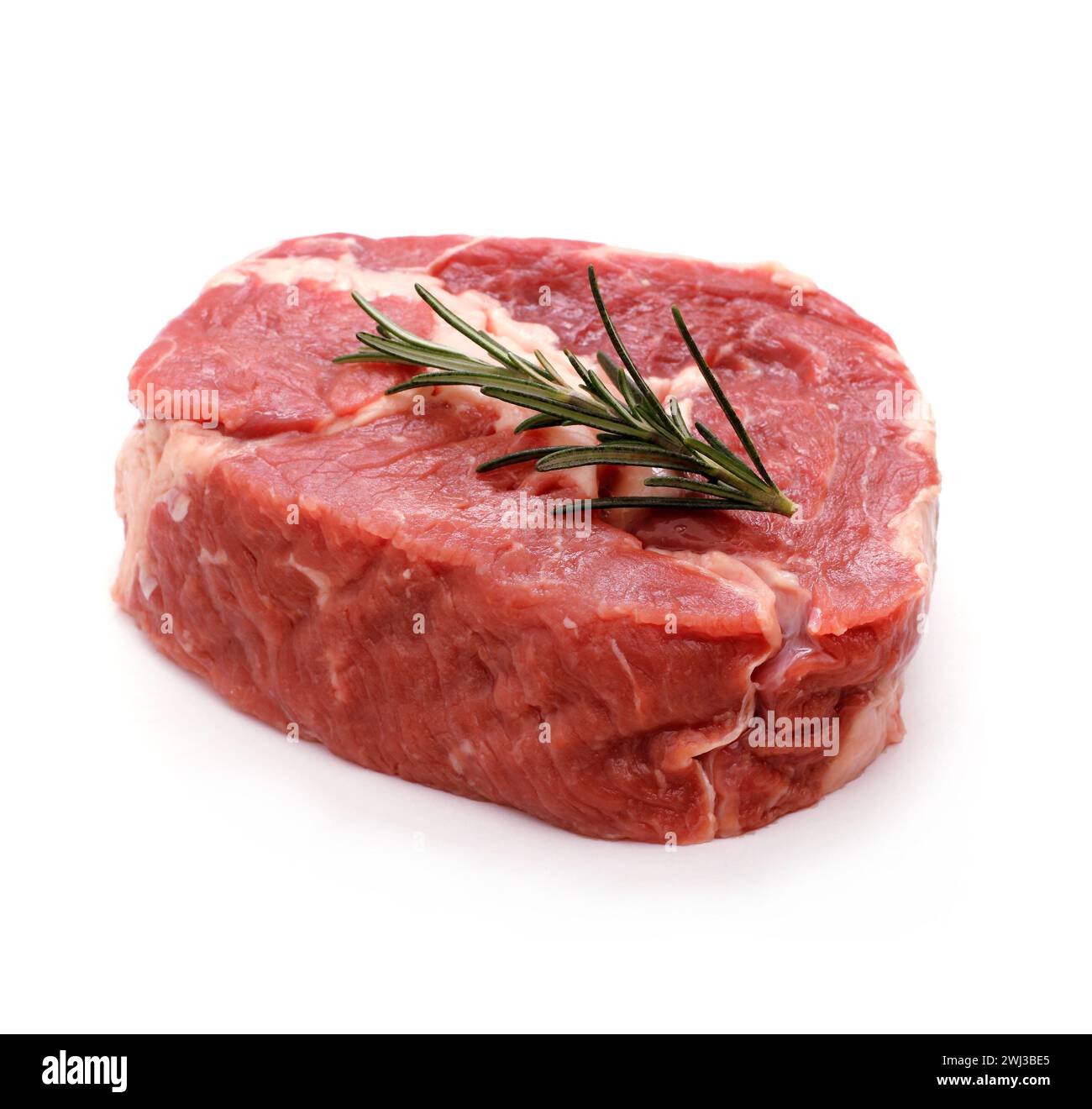 Raw ribeye steak garnished with sprig of rosemary Stock Photo - Alamy