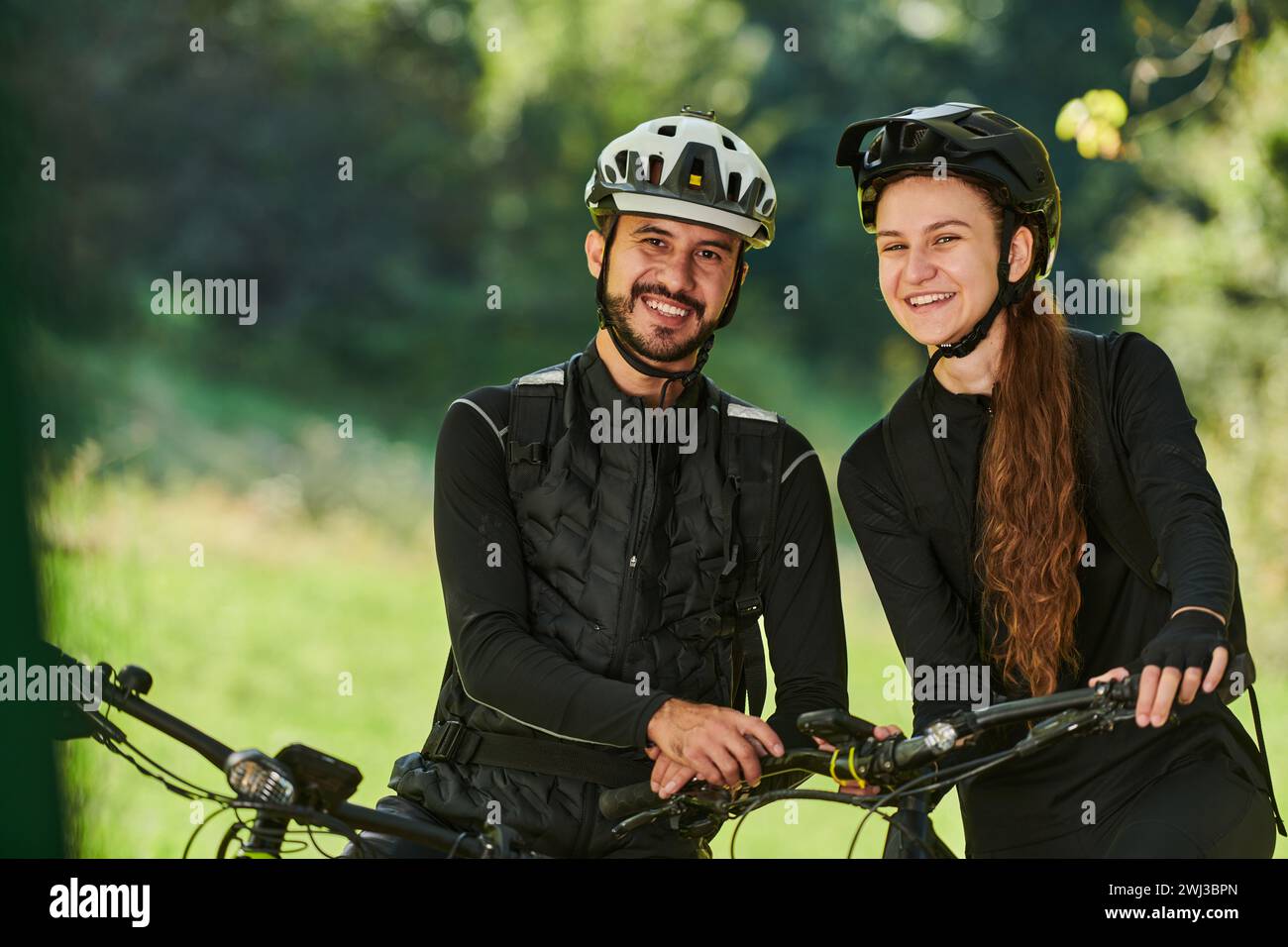 A blissful couple, adorned in professional cycling gear, enjoys a ...