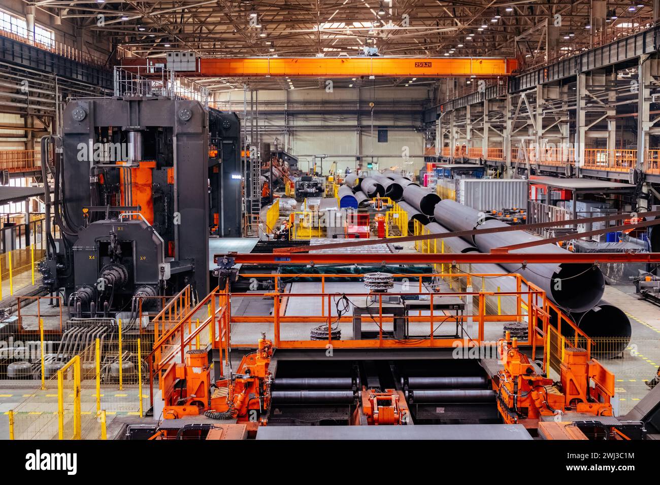 Pipe factory production line. Tube formation by roll sheet bending ...