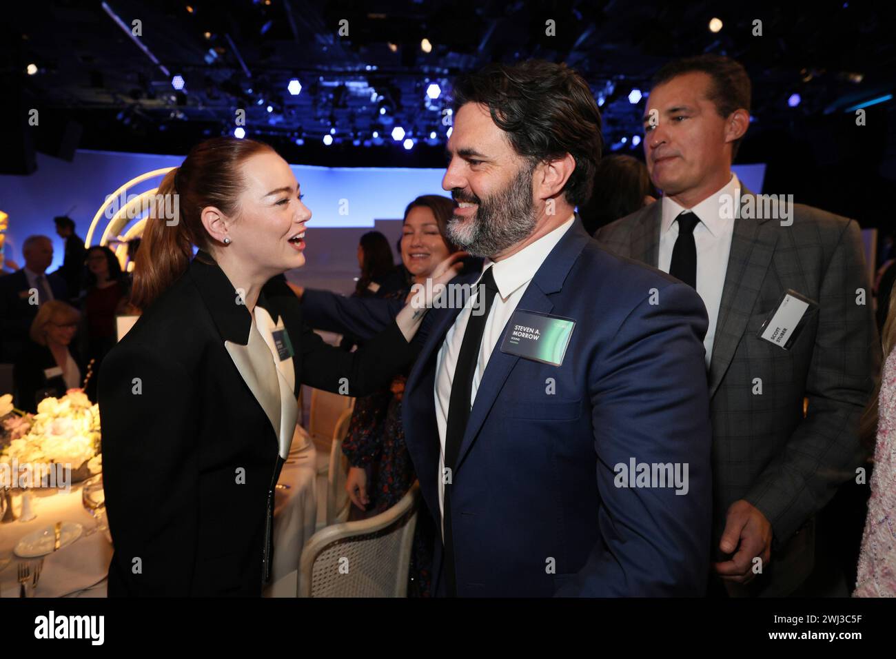 Emma Stone, from left, Steven A. Morrow, and Scott Stuber attend the ...