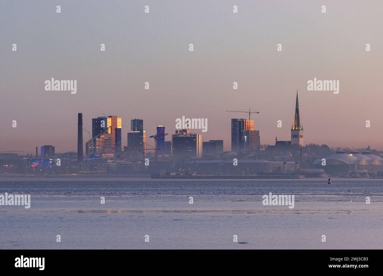 An aerial view of a bustling urban metropolis featuring a cluster of high-rise buildings and a ...