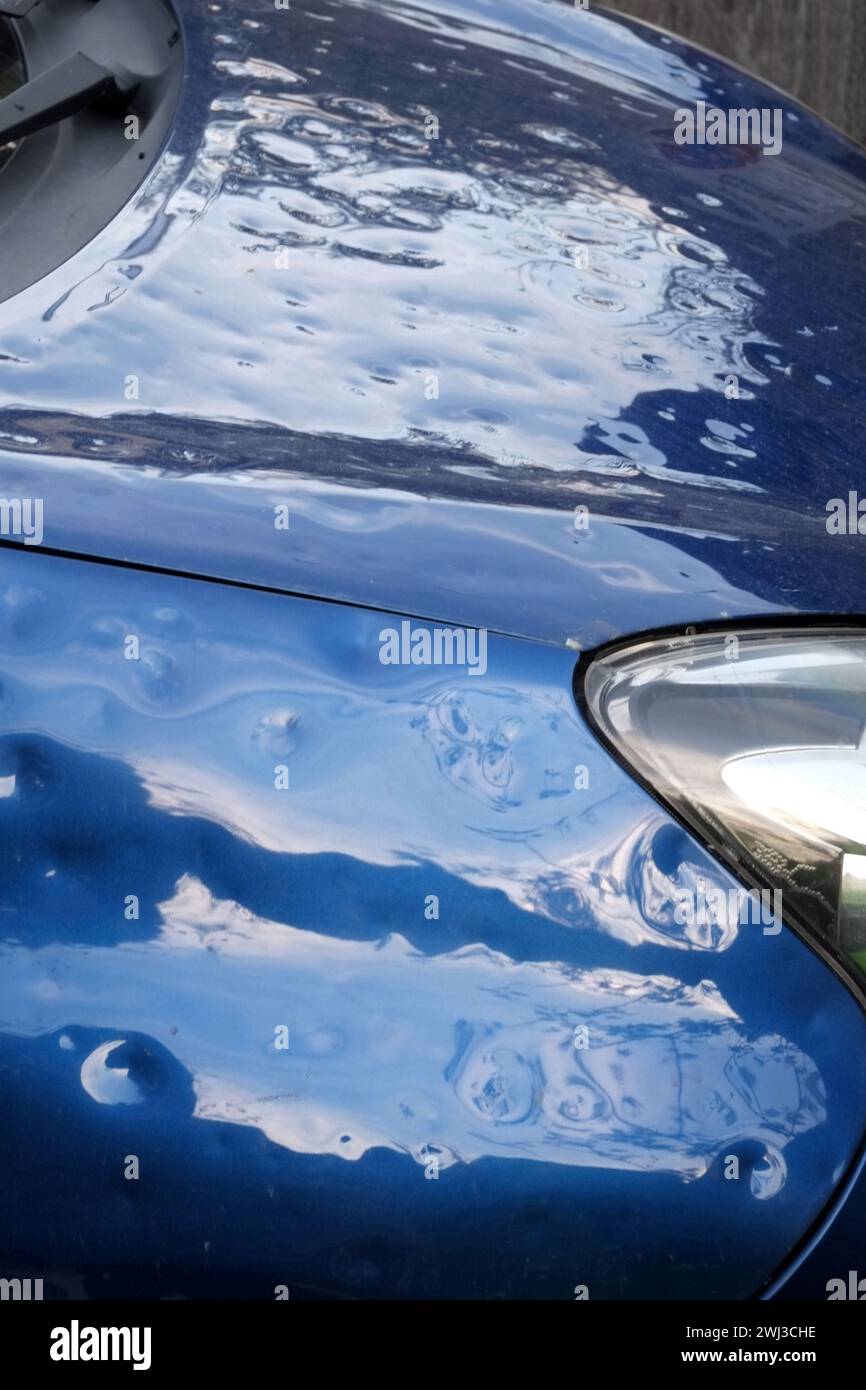 Hail damage in the bonnet Stock Photo - Alamy