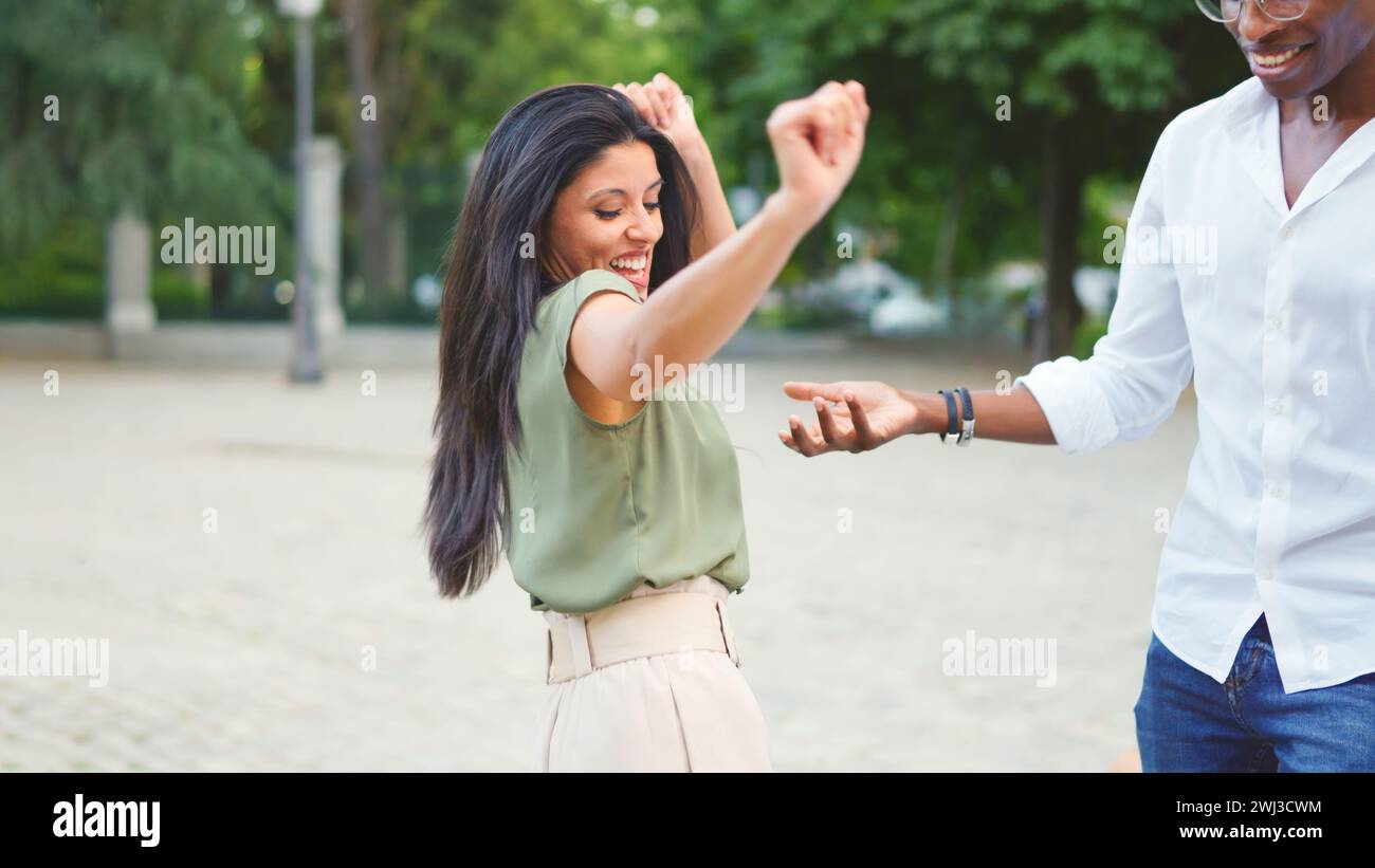 Group of multiethnic friends dancing in the street Stock Photo - Alamy