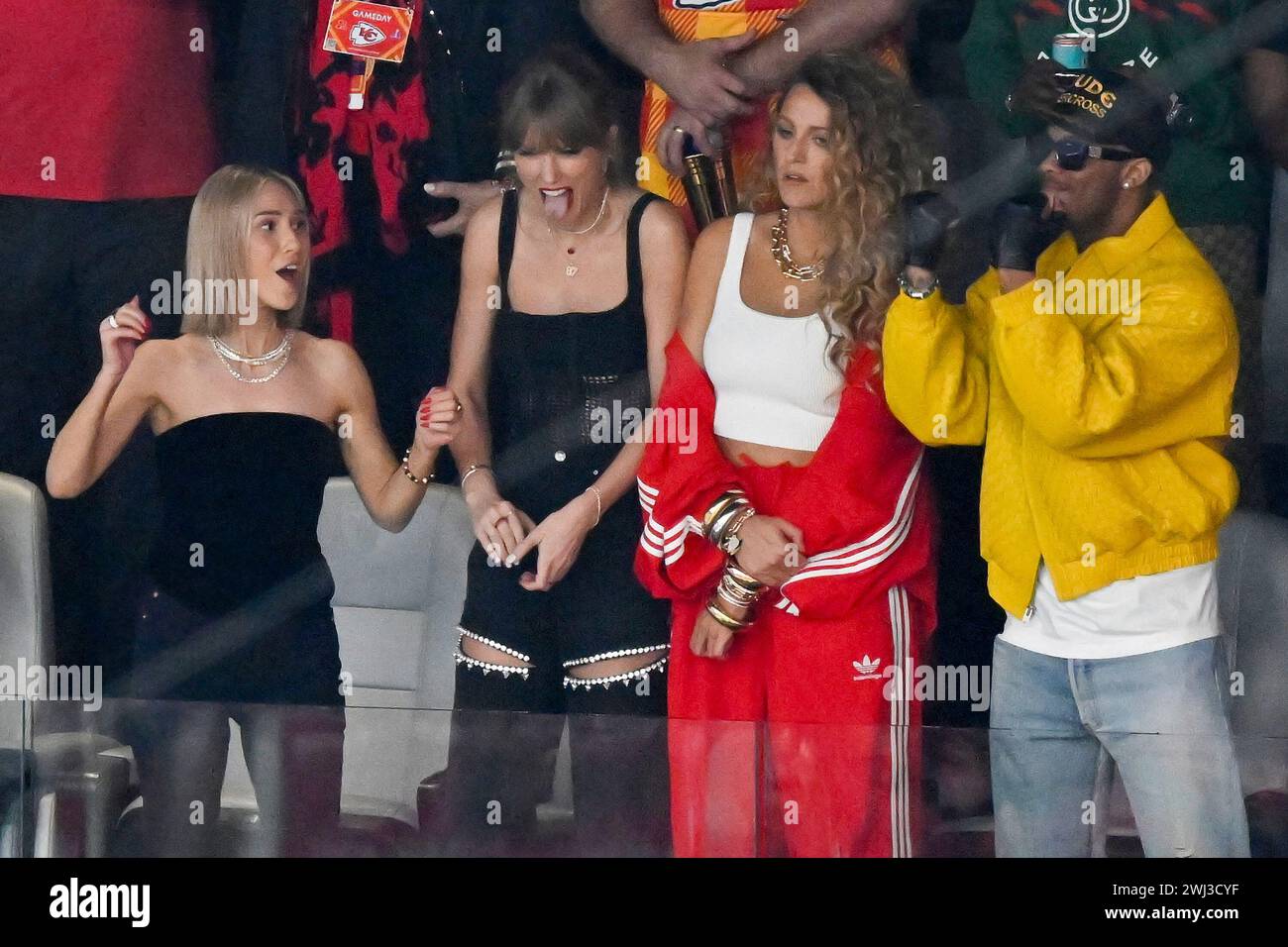 Ashley Avignone, from left, Taylor Swift and Blake Lively react during ...