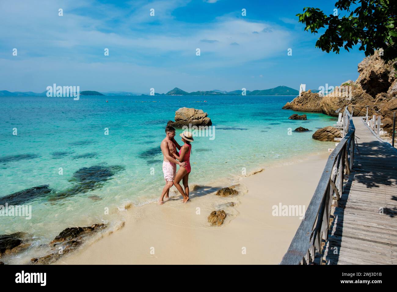 A couple of men and woman at Ko Kham tropical Island Sattahip Chonburi ...