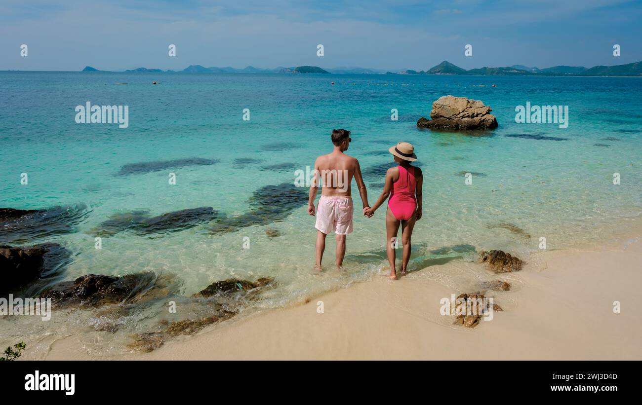 A couple of men and woman at Ko Kham tropical Island Sattahip Chonburi ...