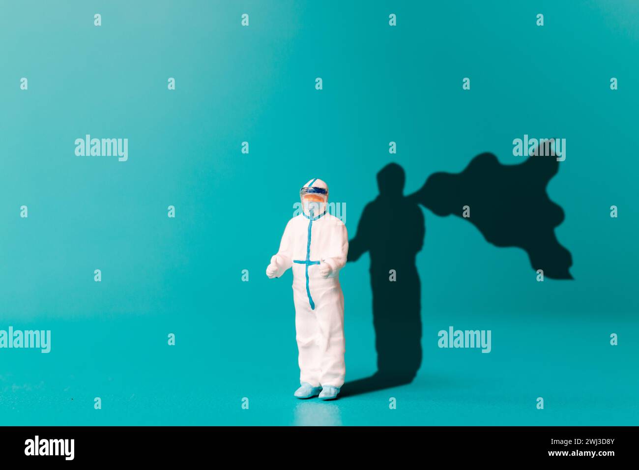 Miniature people Doctor with superhero shadow on the wall Stock Photo ...