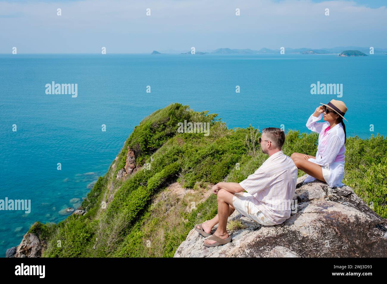 A couple of men and woman at Ko Kham tropical Island Sattahip Chonburi ...