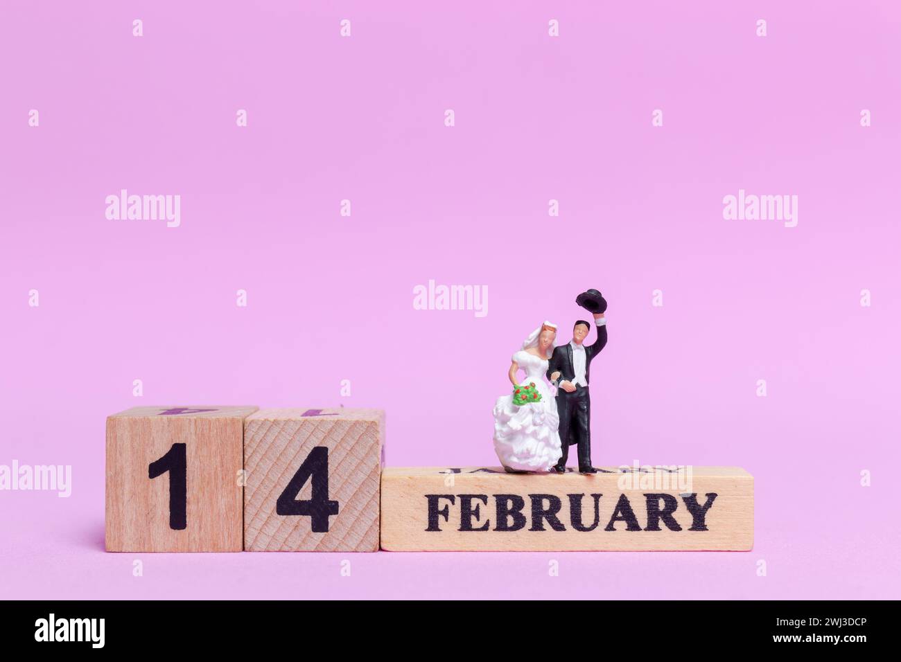 Miniature people wedding , bride and groom couple on pink background ...