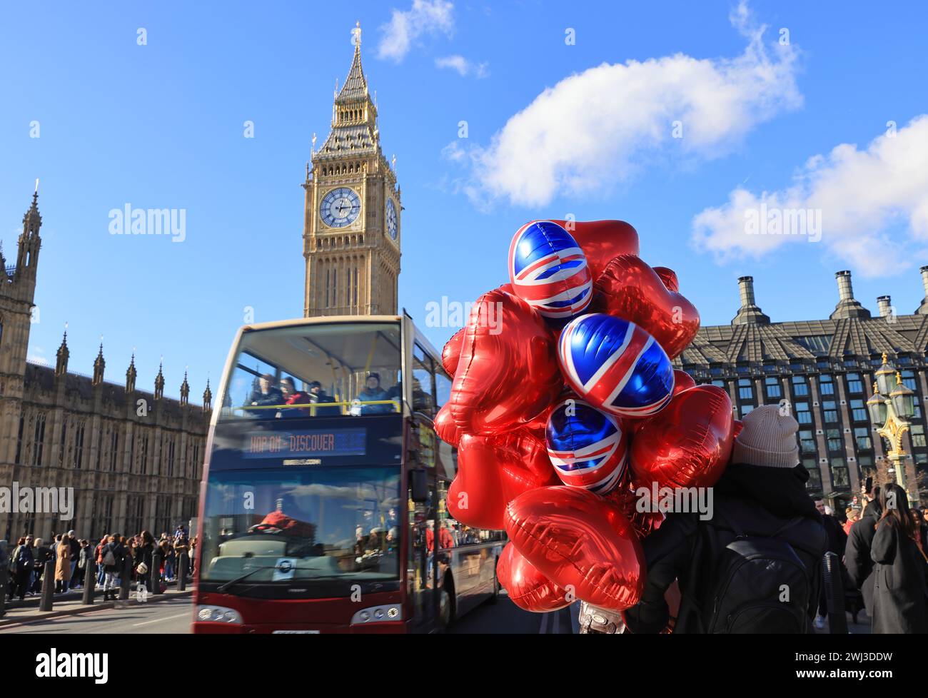 Red, Valentine heart balloons on sale on Westminster Bridge, with Big ...