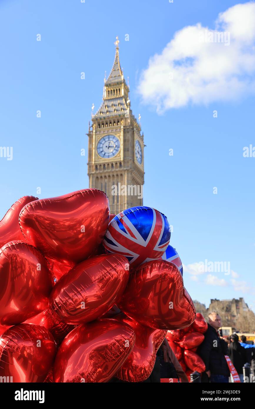 Red, Valentine heart balloons on sale on Westminster Bridge, with Big ...