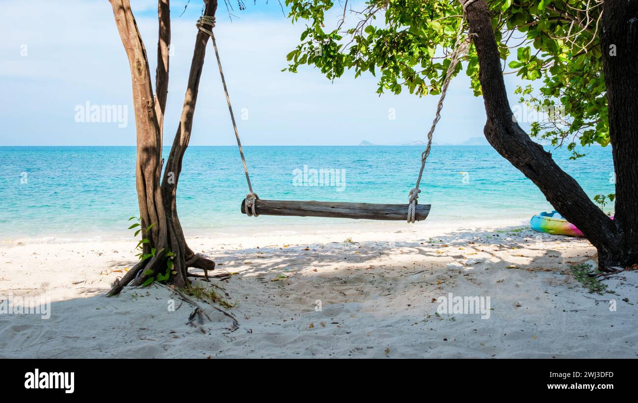 A swing under a tree at the beach of Ko Kham Island Sattahip Chonburi ...