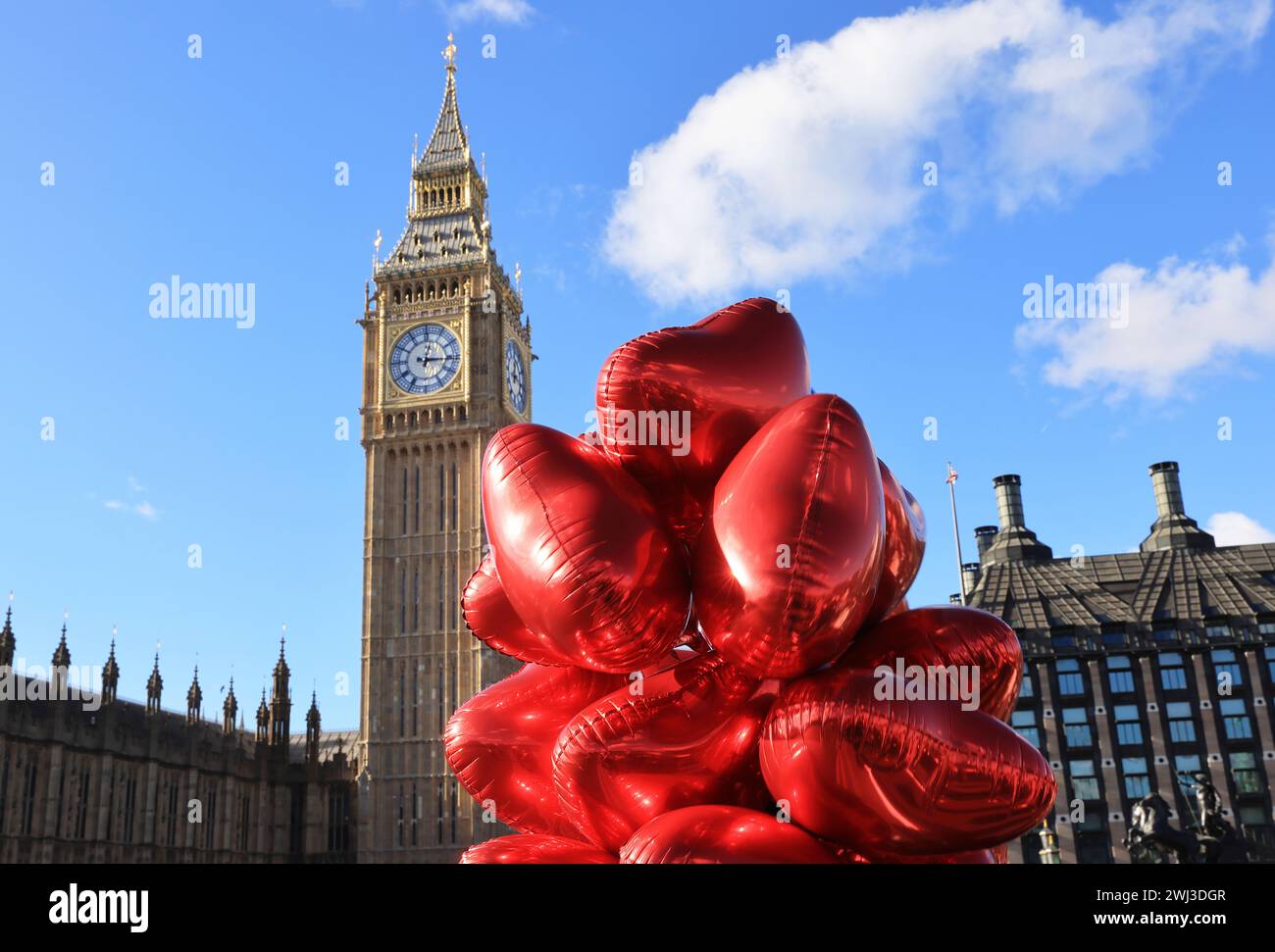 Red, Valentine heart balloons on sale on Westminster Bridge, with Big ...
