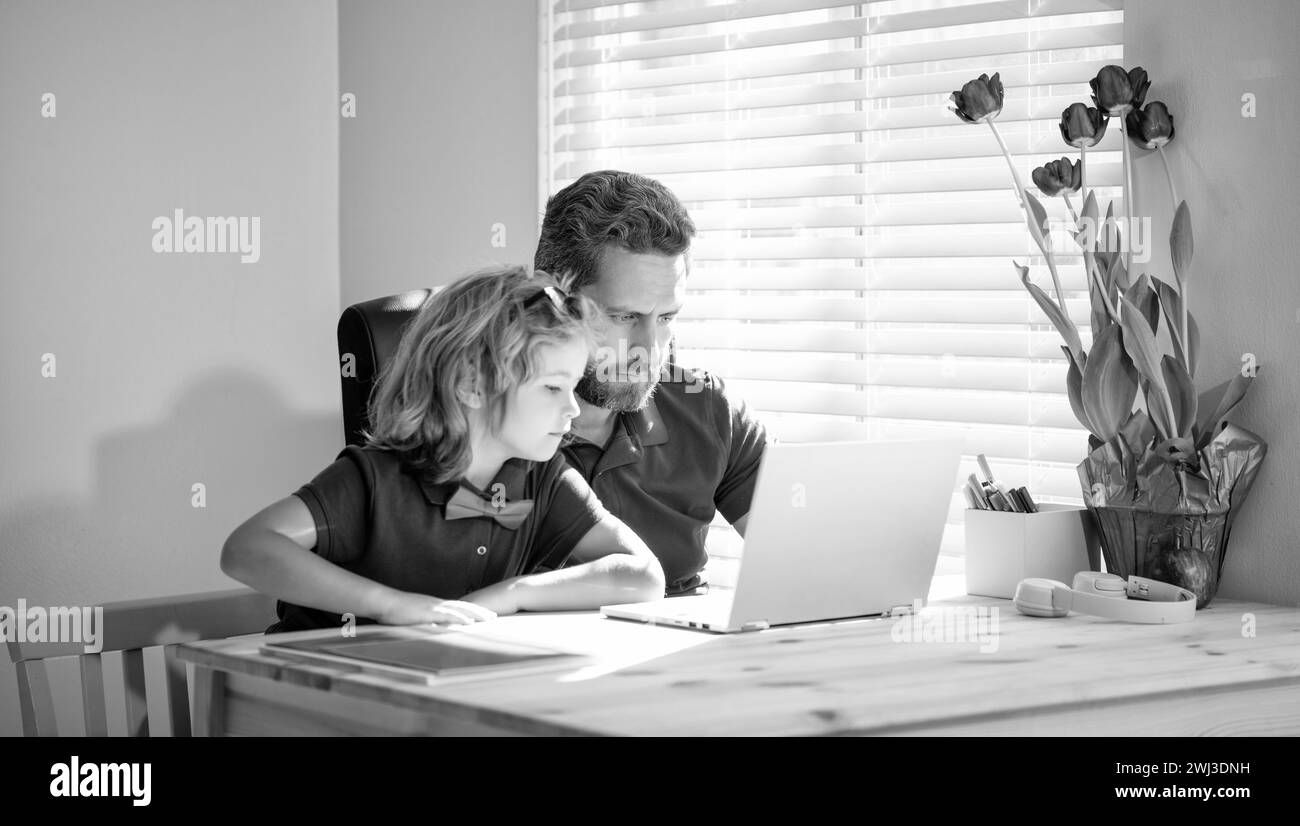 curious father and son use communication technology at home. family ...