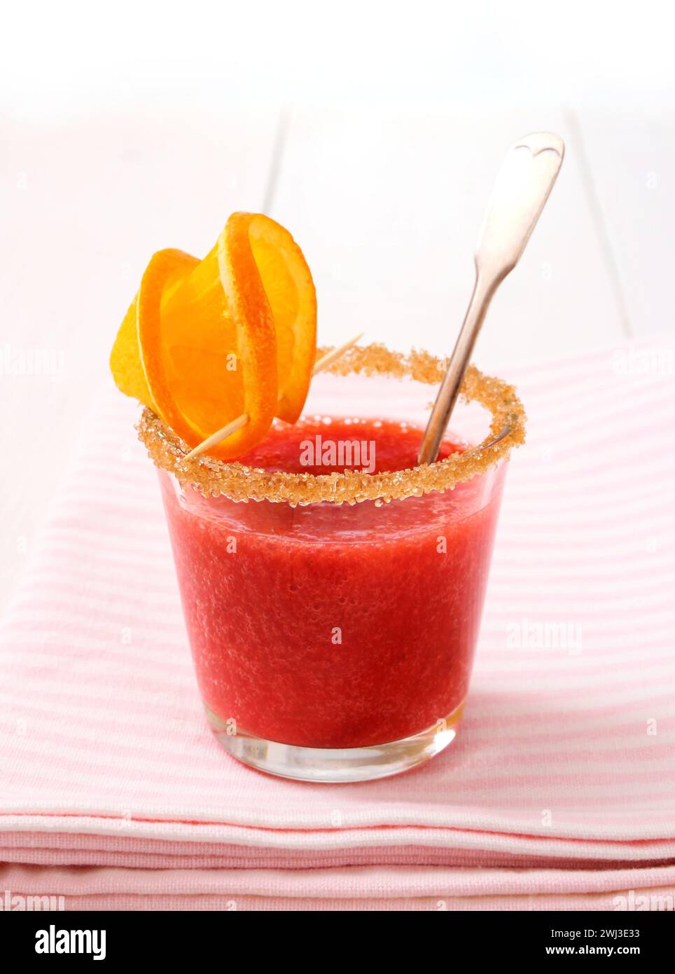 Strawberry smoothie topped with brown sugar, orange slice Stock Photo ...