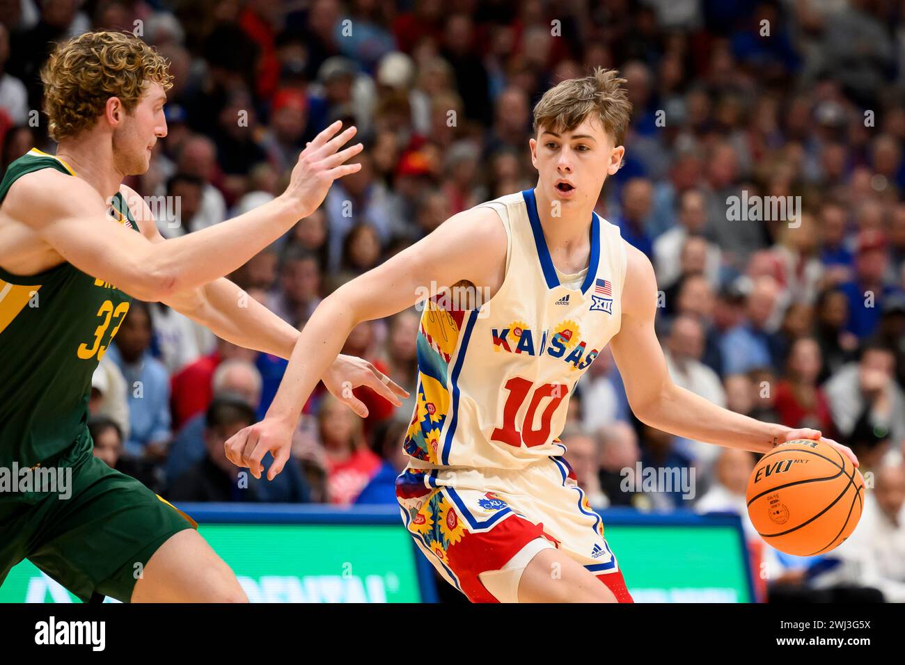 Kansas guard Johnny Furphy (10) tries to drive around Baylor forward ...