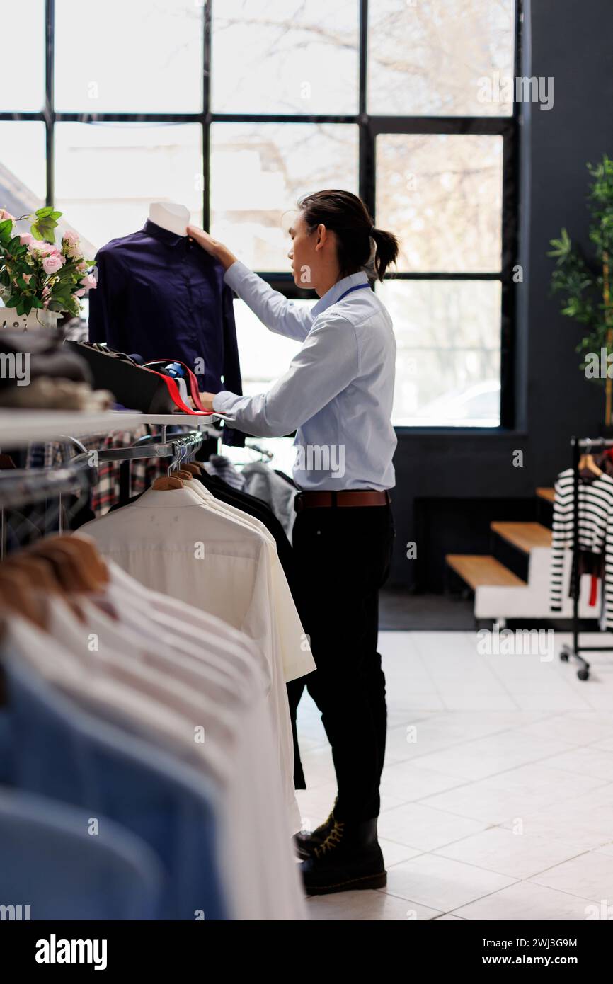 Worker arranging stylish clothes hi-res stock photography and images ...