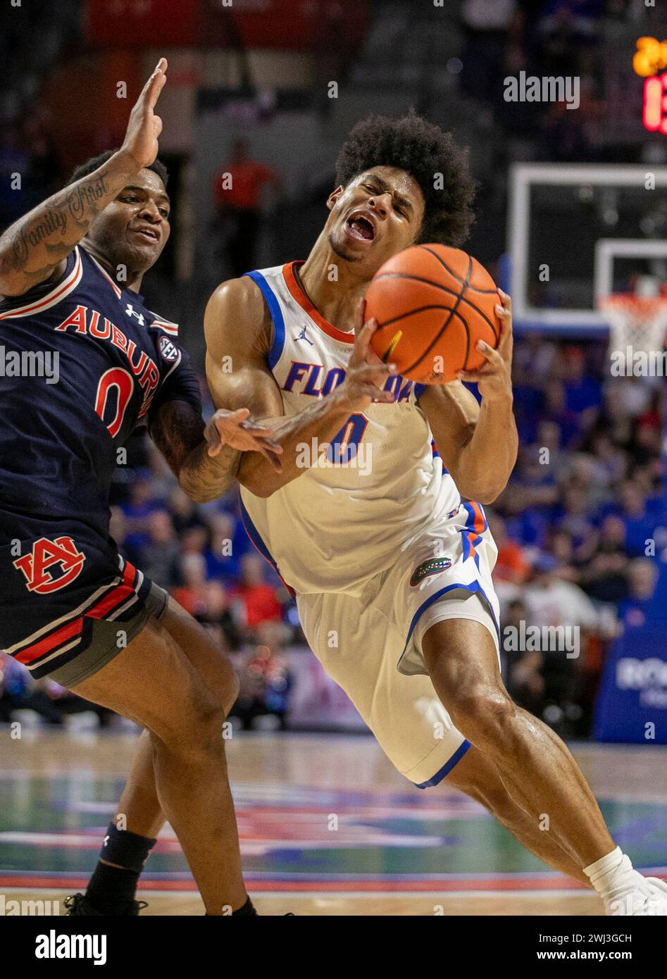 Florida guard Zyon Pullin (0) drives against Auburn guard K.D. Johnson ... Florida guard Zyon Pullin (0) drives against Auburn guard K.D. Johnson ...