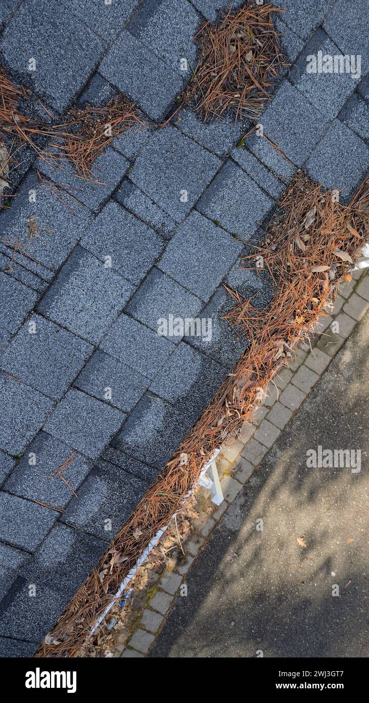 Aerial drone view of residential rain gutter eavestrough filled with ...