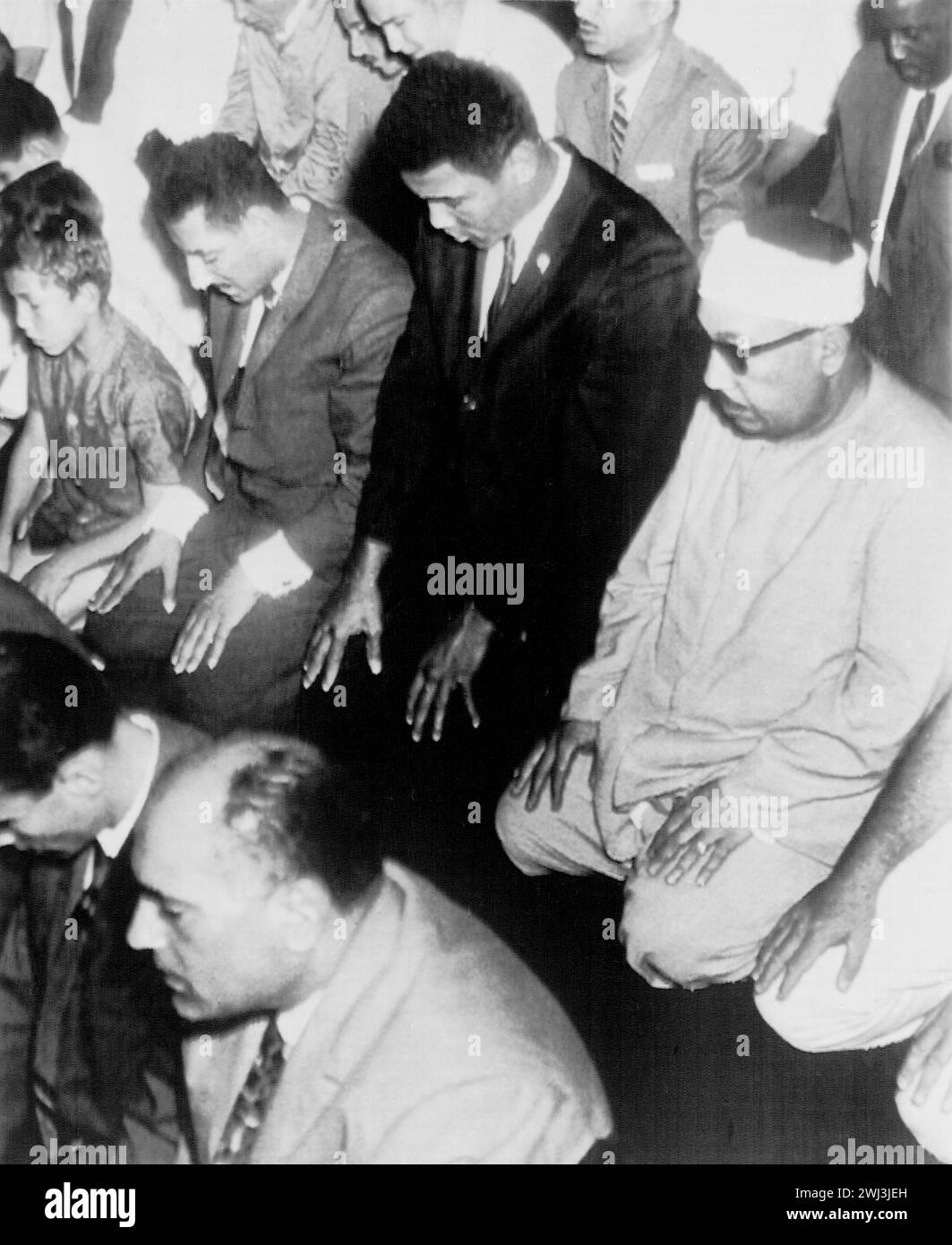 World heavyweight boxing champion Cassius Clay, second from right, rear ...