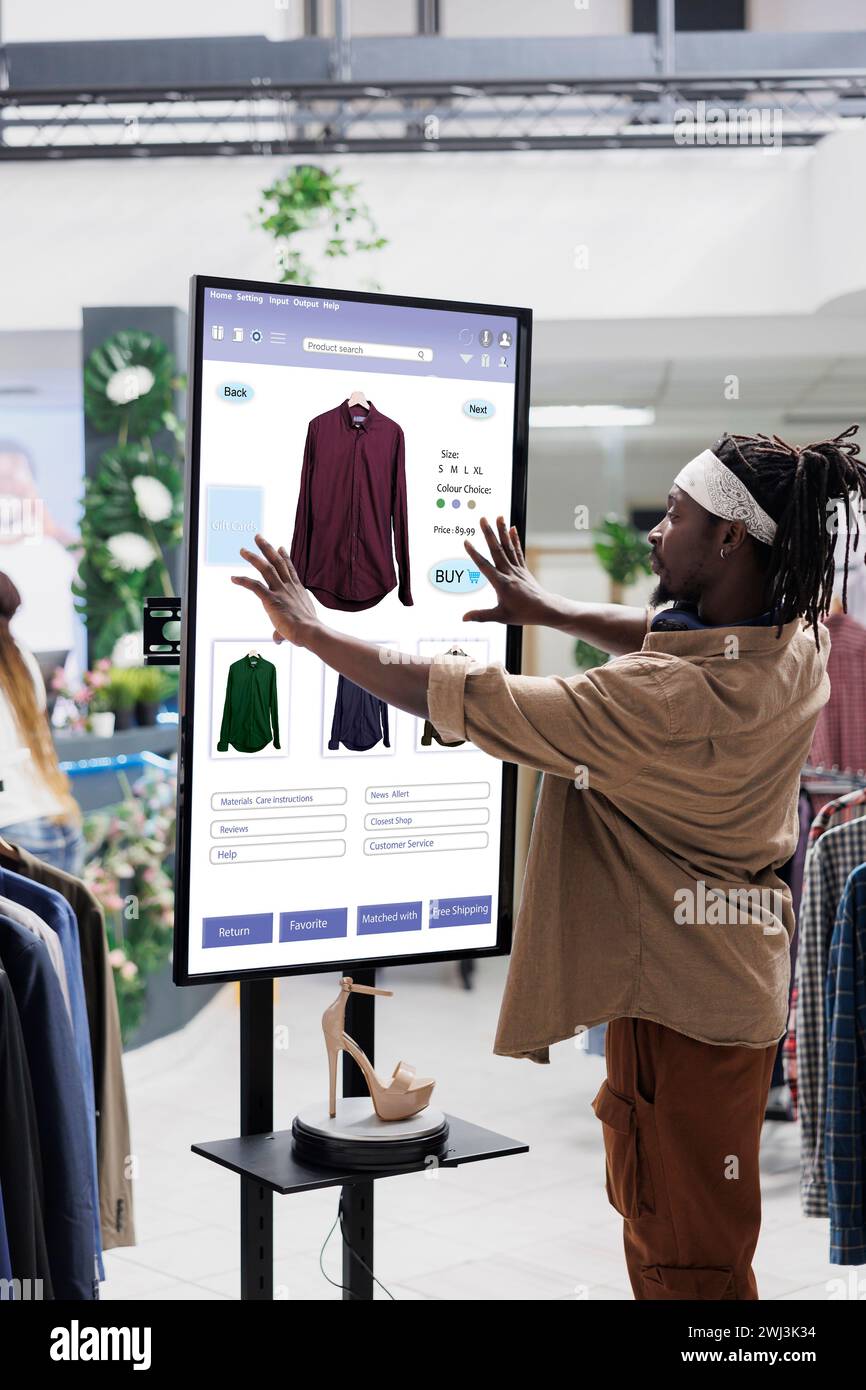 Shopper looks clothing display hi-res stock photography and images - Alamy