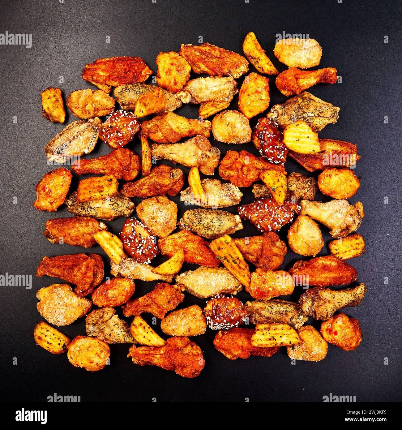 Deep fried Crispy chicken wings with different flavors and sauces on ...