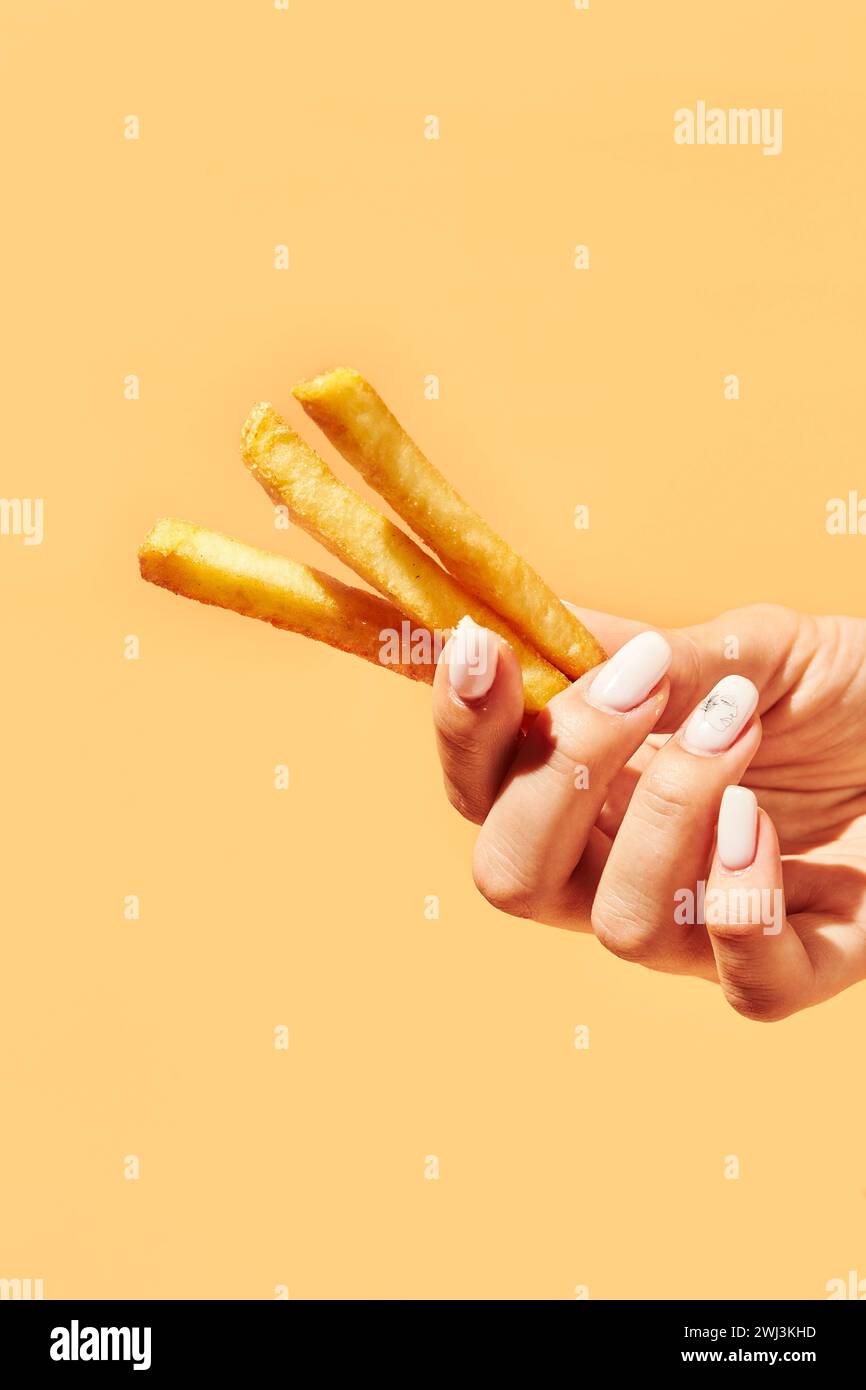 French fries hand food female hi-res stock photography and images - Alamy