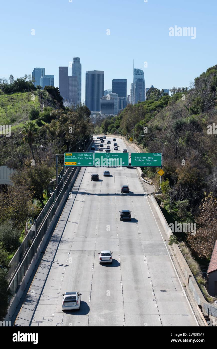 Los Angeles skyline and 110 freeway downtown arrow sign. Vertical view ...