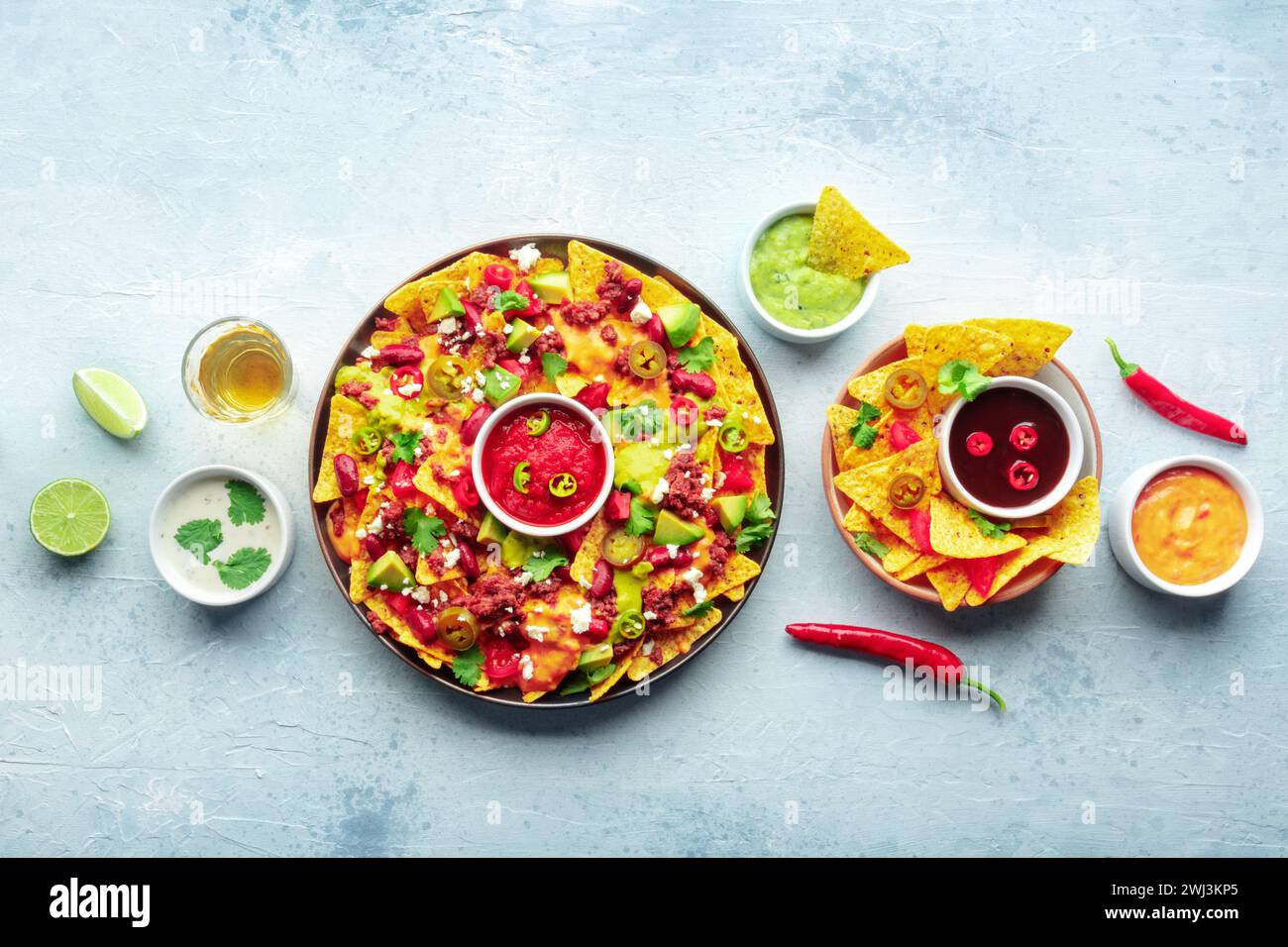 Loaded nachos. Mexican nacho chips with beef, overhead flat lay shot ...