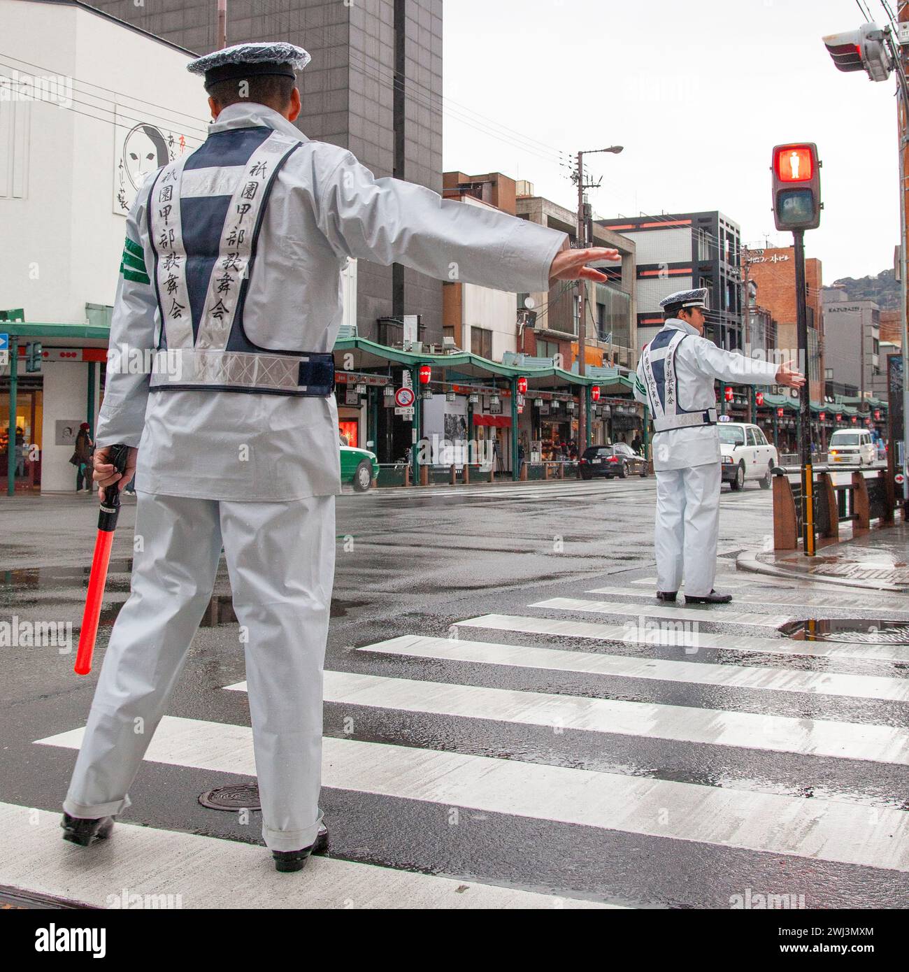 Traffic police at Shijo Street in downtown Gion, Kyoto, Japan during ...