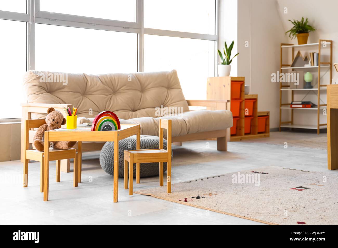 Interior of child psychologist's office with sofa and table Stock Photo ...