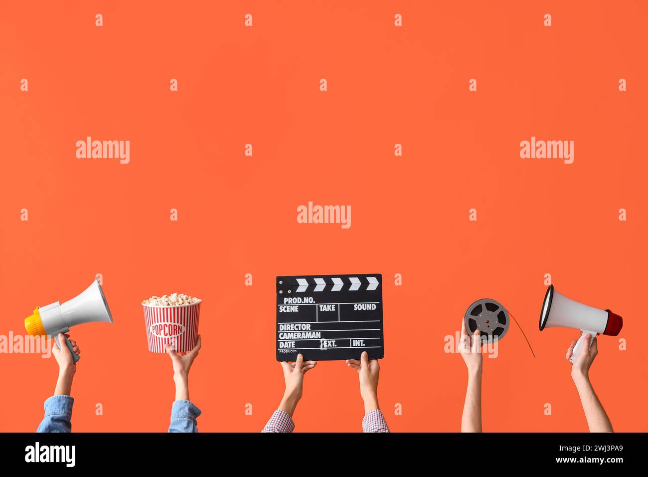Many hands with bucket of popcorn, movie clapper and megaphones on ...