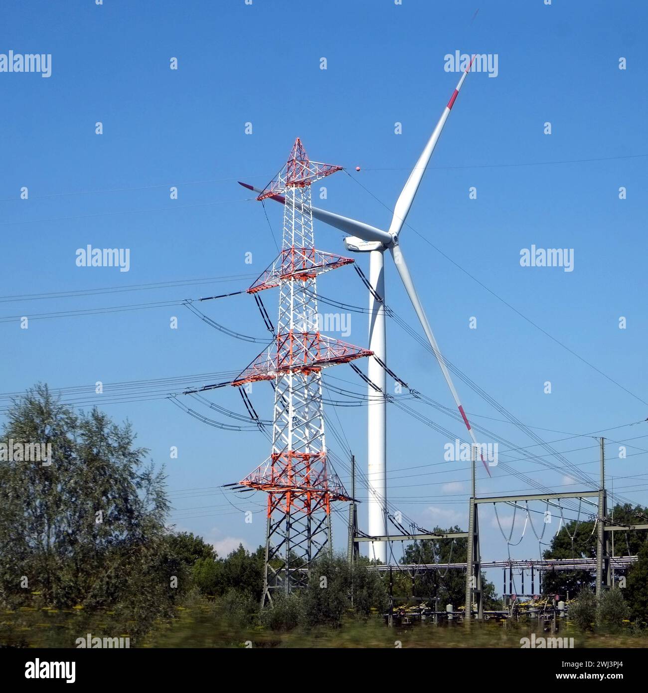 Wind turbine and high-voltage power line Stock Photo - Alamy