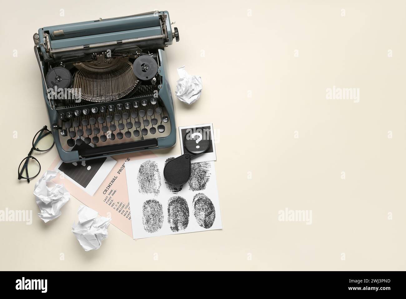 Composition with retro typewriter, criminal files and crumpled paper ...