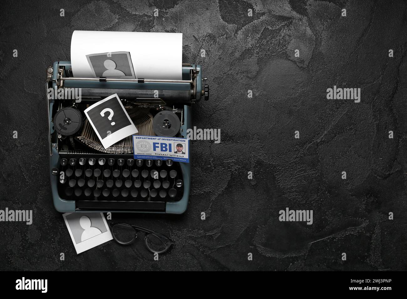 Retro typewriter, document of FBI agent and question mark on dark ...