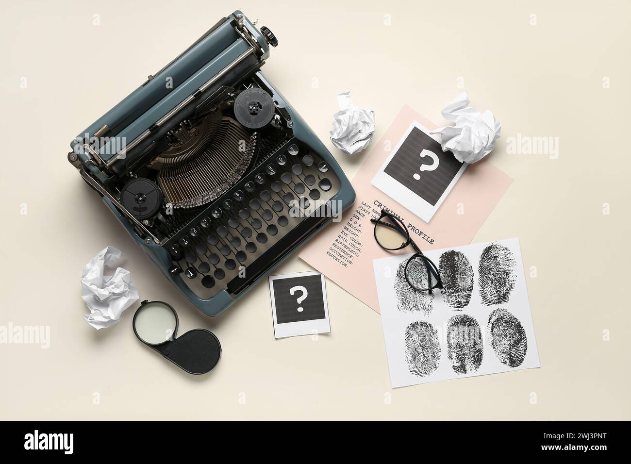 Composition with retro typewriter, criminal files and crumpled paper ...