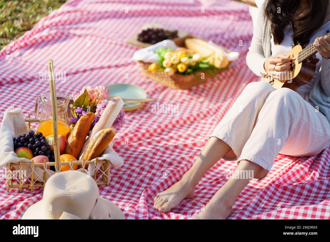 In love couple enjoying picnic time playing guitar in park outdoors Picnic. happy couple ...