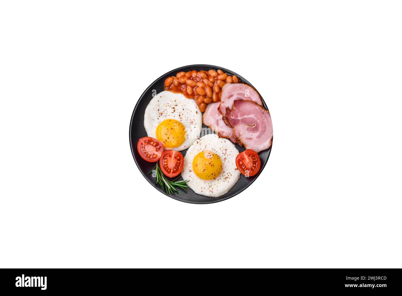 Delicious nutritious English breakfast with fried eggs and tomatoes ...