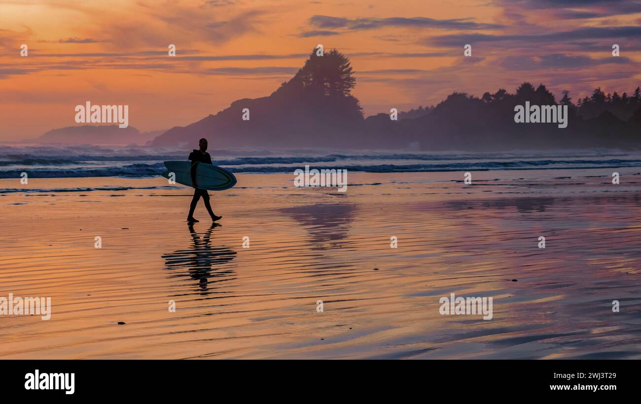 Tofino Vancouver Island Pacific rim coast, surfers with board during ...