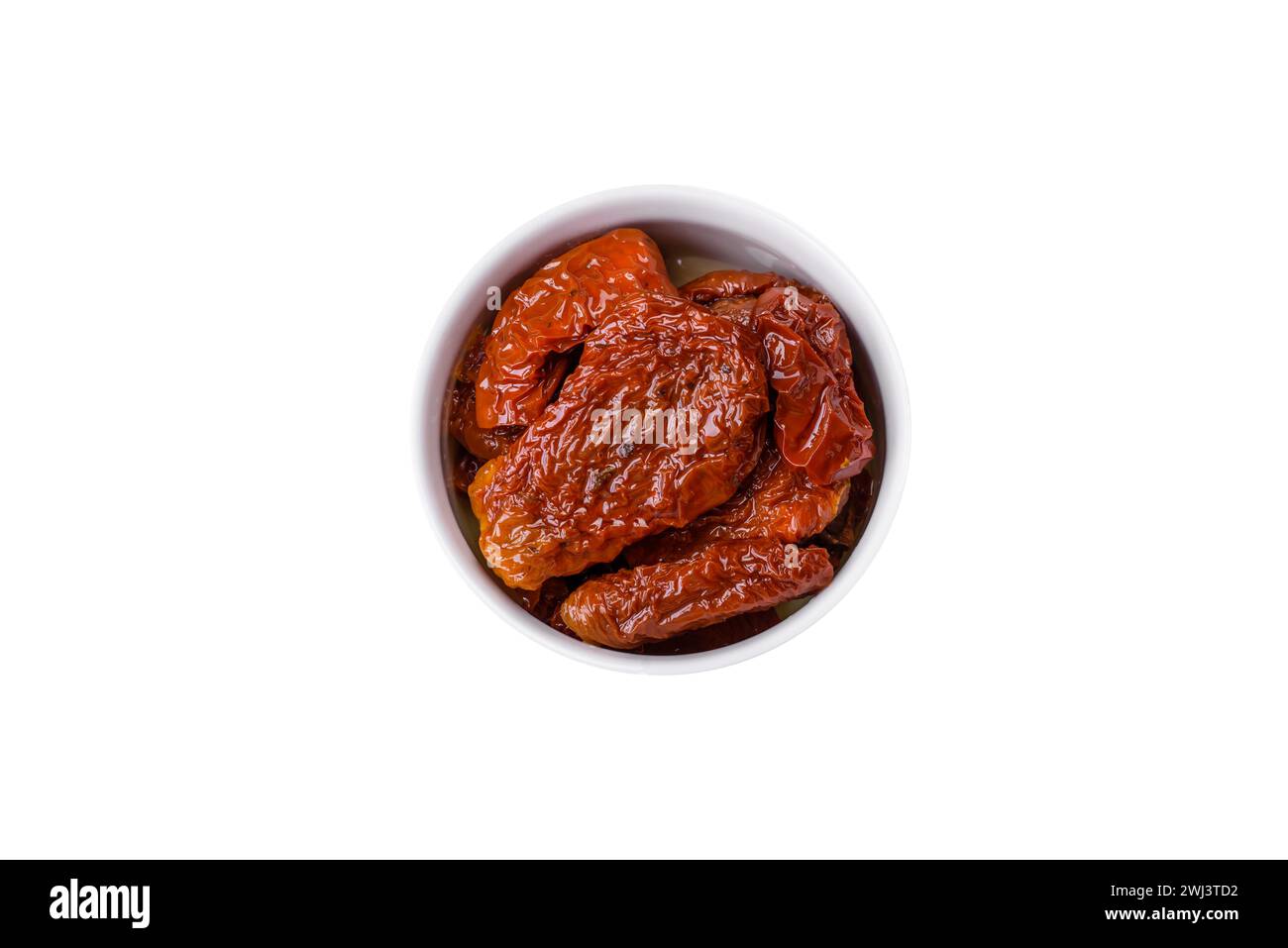 Delicious sun dried tomatoes in oil in a white ceramic bowl Stock Photo ...