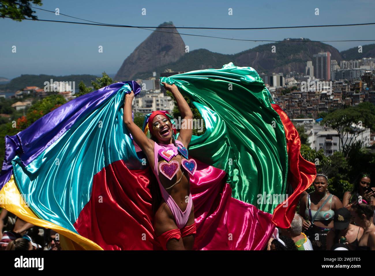 Raquel Poti performs on stilts during the Carmelitas street party on ...