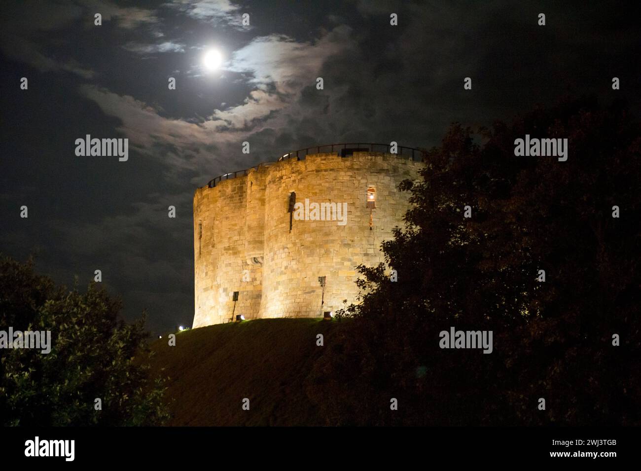 Cliffords Tower, York, UK, at night under a full moon Stock Photo - Alamy