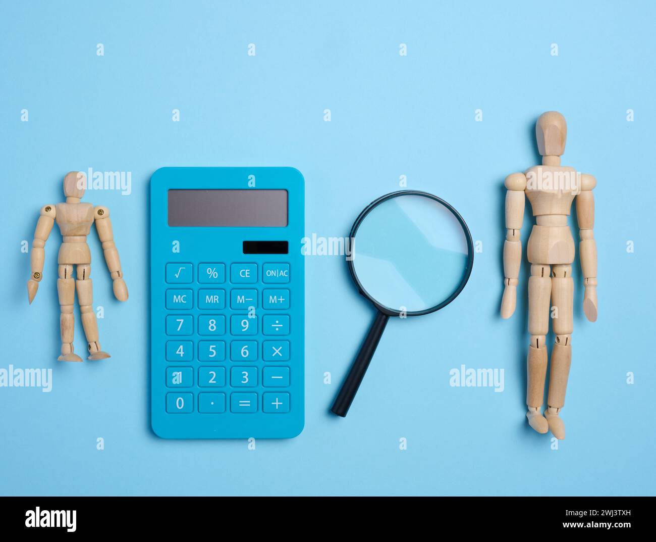Wooden mannequin, magnifier and blue calculator. Concept of counting ...