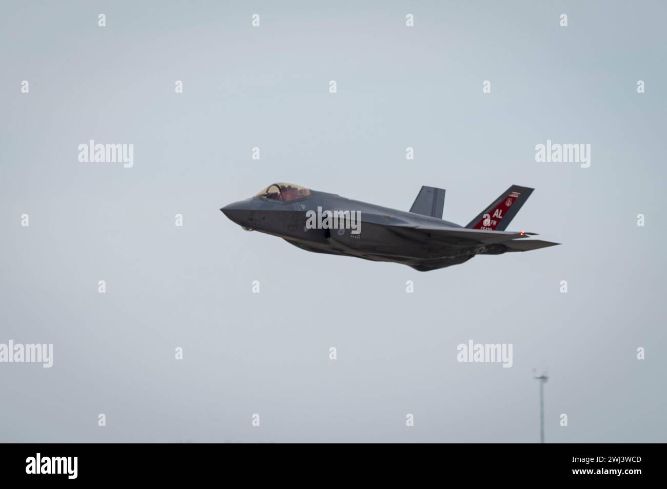 An F-35 Lightning II flies past the crowd as part of a flyover ...